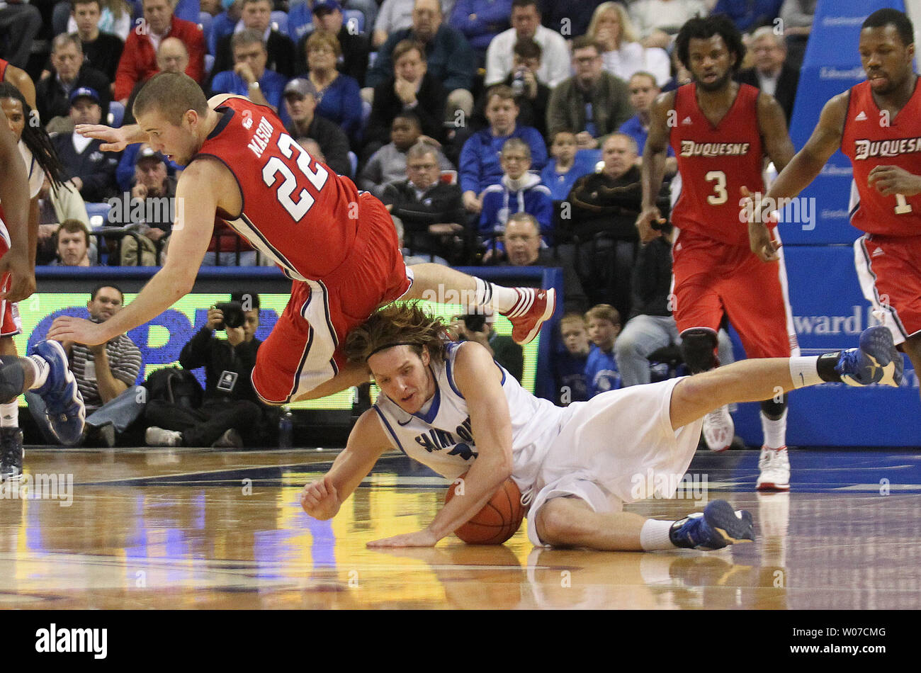 Saint Louis University Billikens Jake Barnett goes after the basketball ...