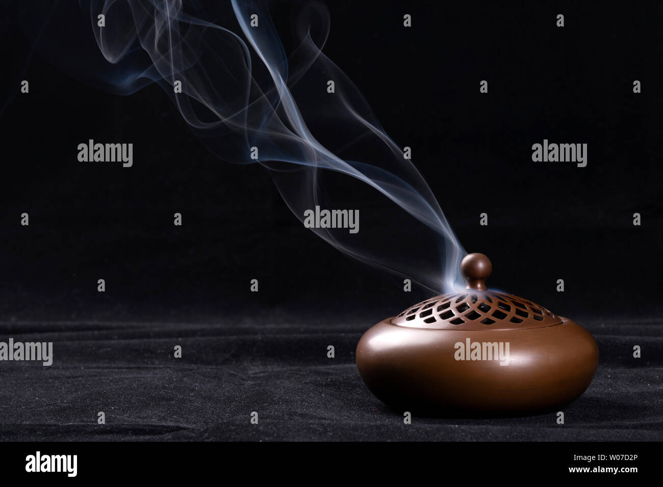 Copper incense stove Stock Photo - Alamy