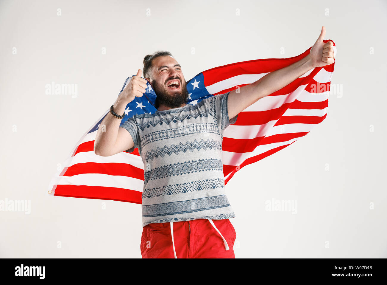 Celebrating an Independence day. Stars and Stripes. Young man with the ...
