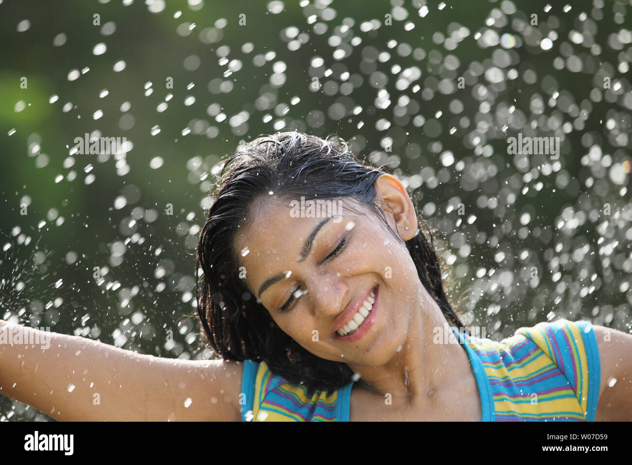 Close up of an Indian young woman enjoying rain Stock Photo - Alamy