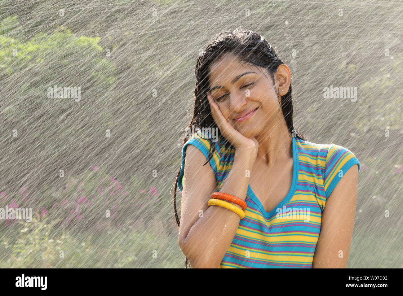 Indian girl enjoying rain hi-res stock photography and images - Alamy