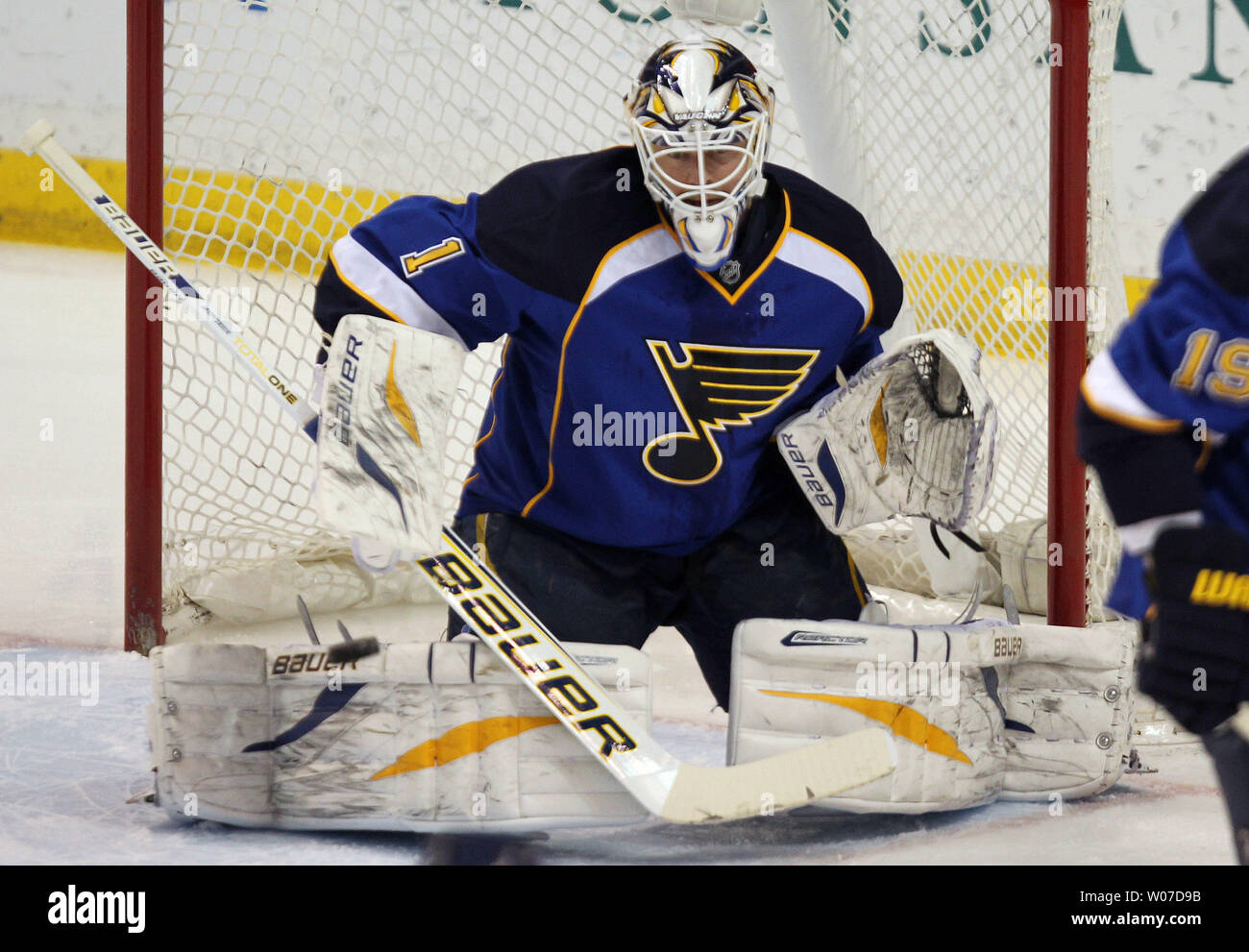 St. Louis Blues goaltender Brian Elliott keeps an eye on the puck shot ...