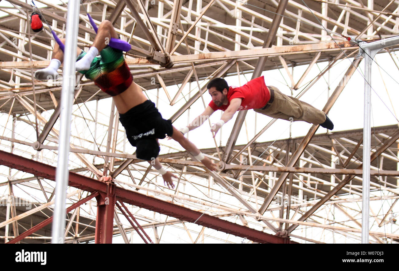 Jason English of Detroit (L) reaches for the hands of Matt Viverito of ...