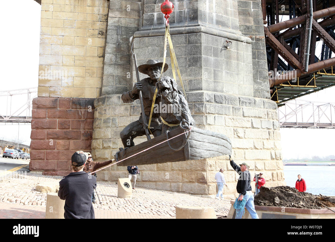 Section two of "The Captains Return" statue is lifted by crane from its ...
