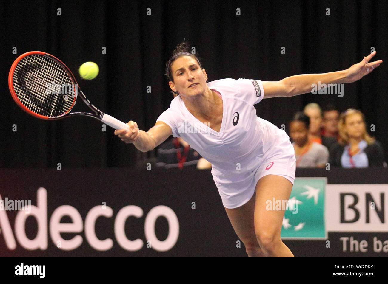 Virginie Razzano of France returns the serve from Sloane Stephens of ...