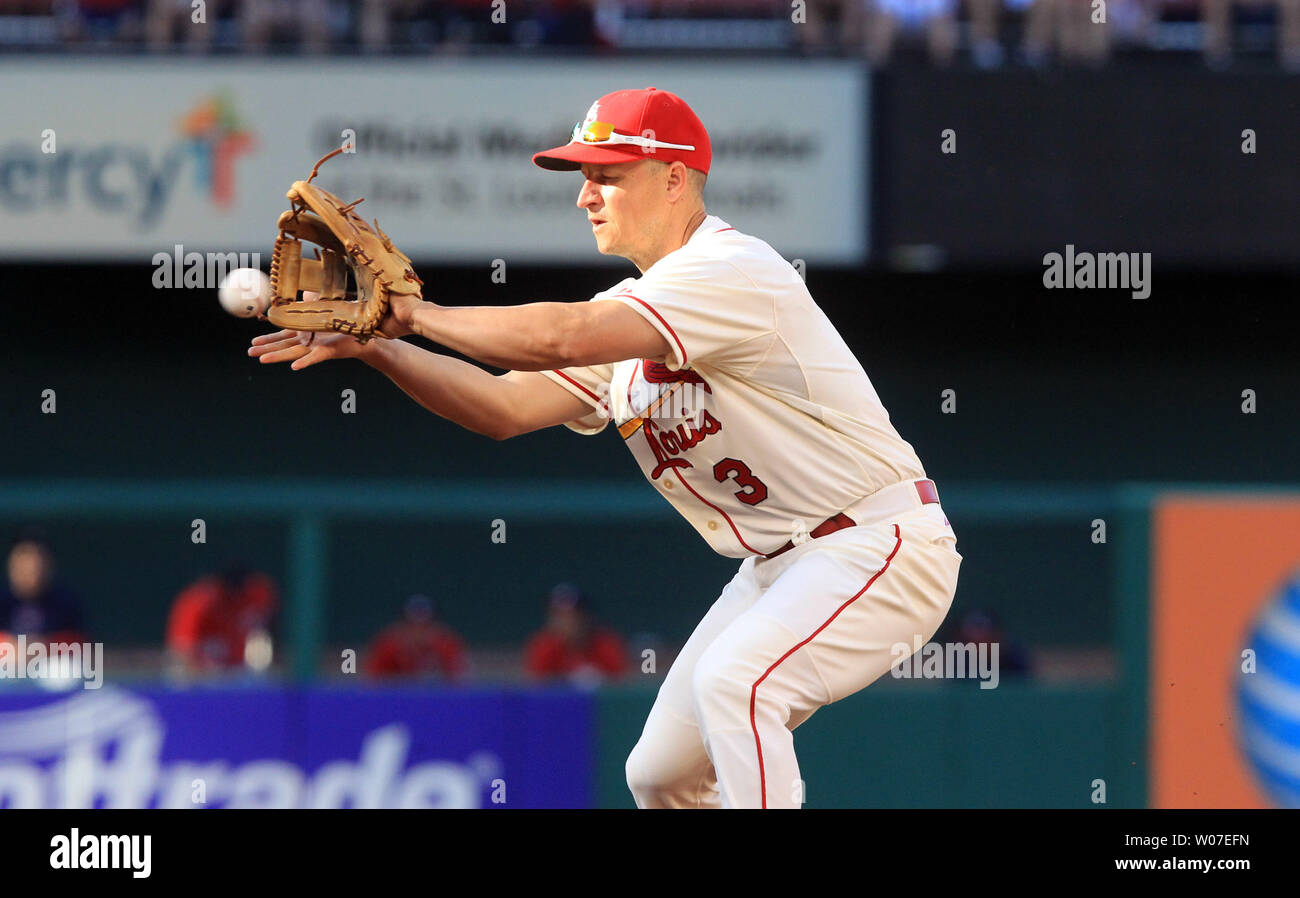 St. Louis Cardinals second baseman Mark Ellis fields a baseball off the ...