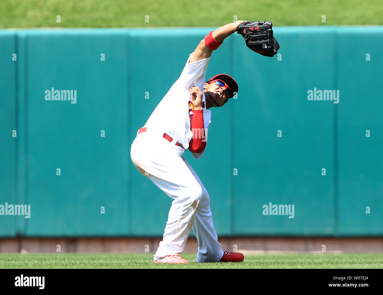 St. Louis Cardinals center fielder Jon Jay fights the sun to make a ...