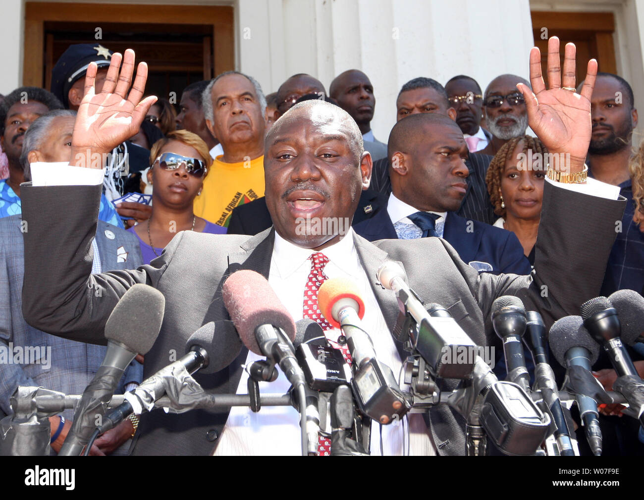 Attorney Benjamin L. Crump throws his hands up during a press ...
