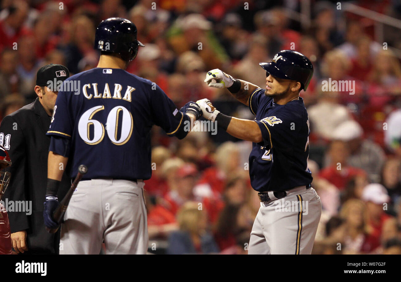 MIlwaukee Brewers Gerardo Parra is greeted at home plate by Matt Clark ...