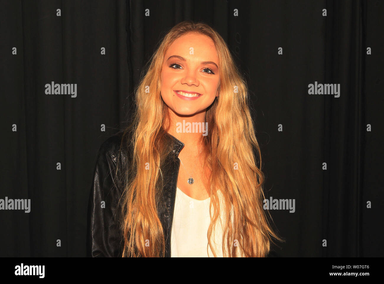 Country singer Danielle Bradbery prepares to go on stage for a concert ...
