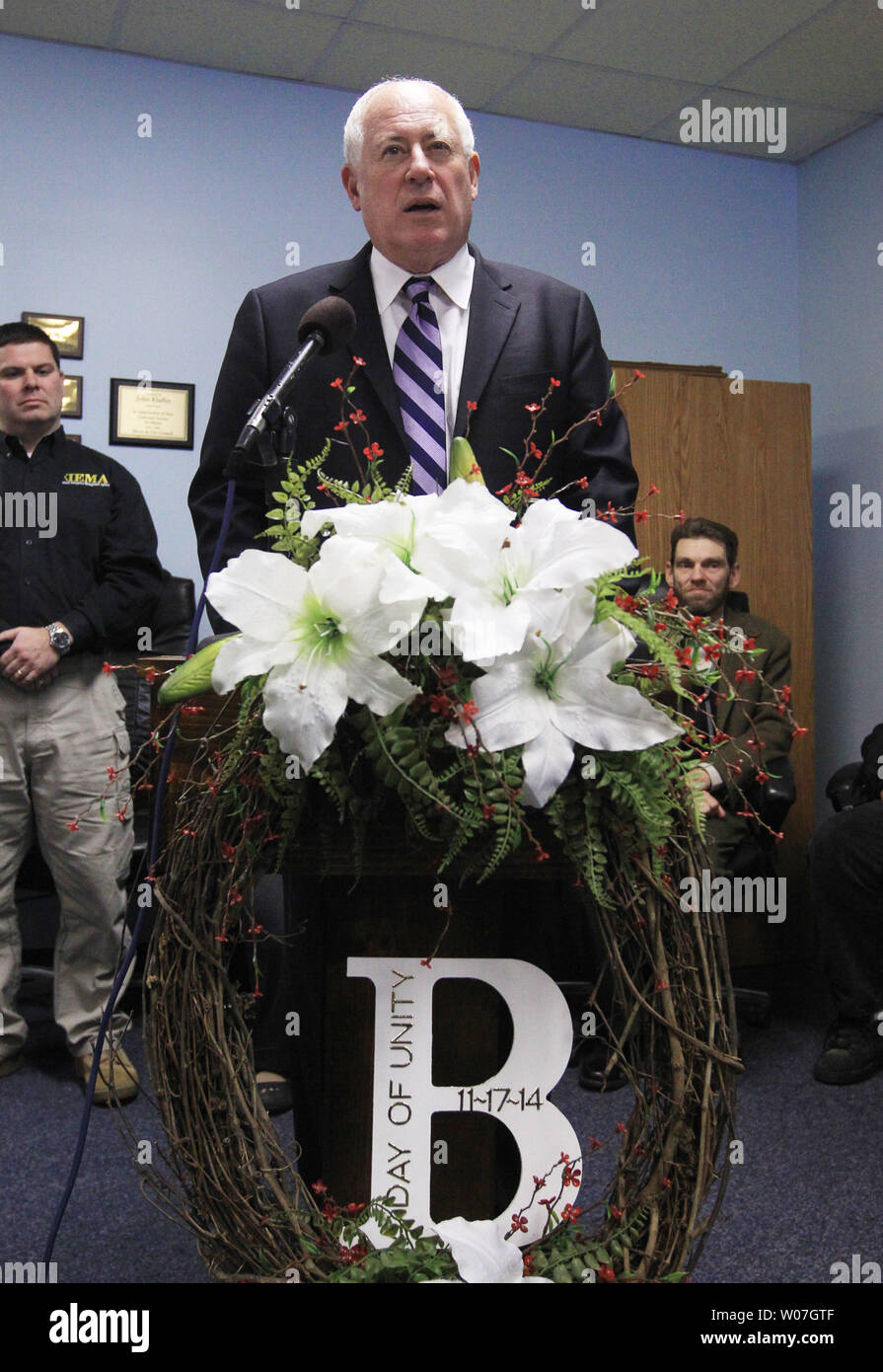 Illinois Governor Pat Quinn joins the relatives of those killed in the ...