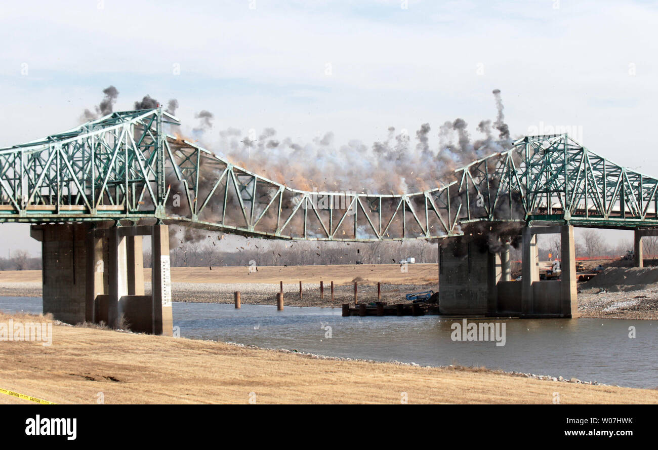 Explosives denonate bringing down the eastbound bridge over the ...