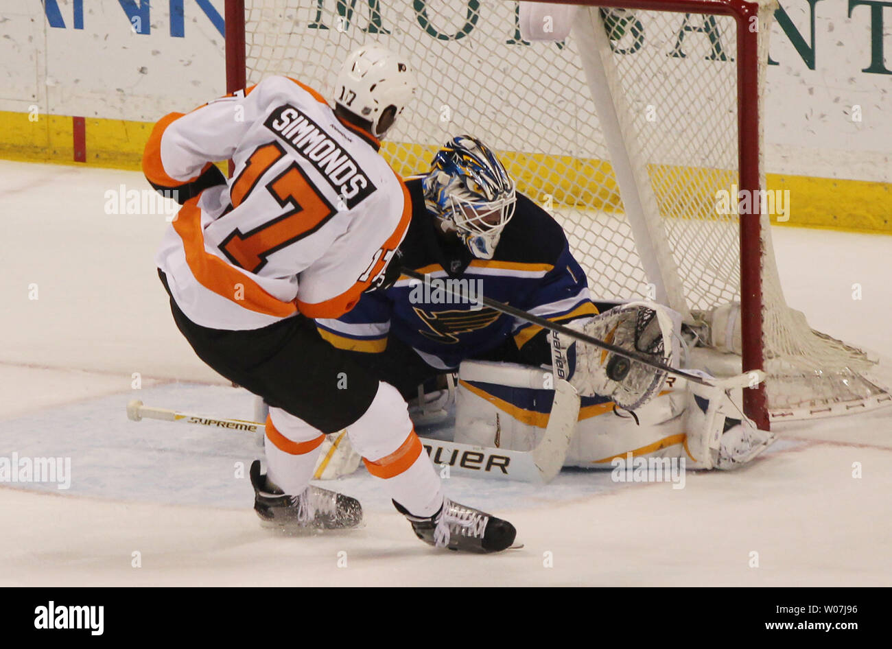 St. Louis Blues goaltender Brian Elliott makes a glove save a shot by ...