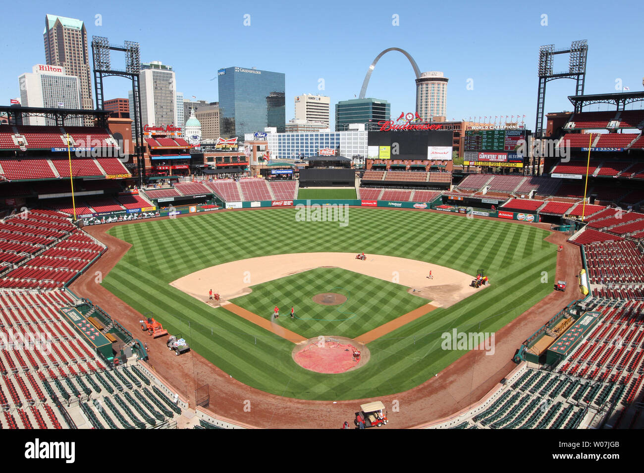 Busch Stadium grounds crew members put the finishing touches on the ...