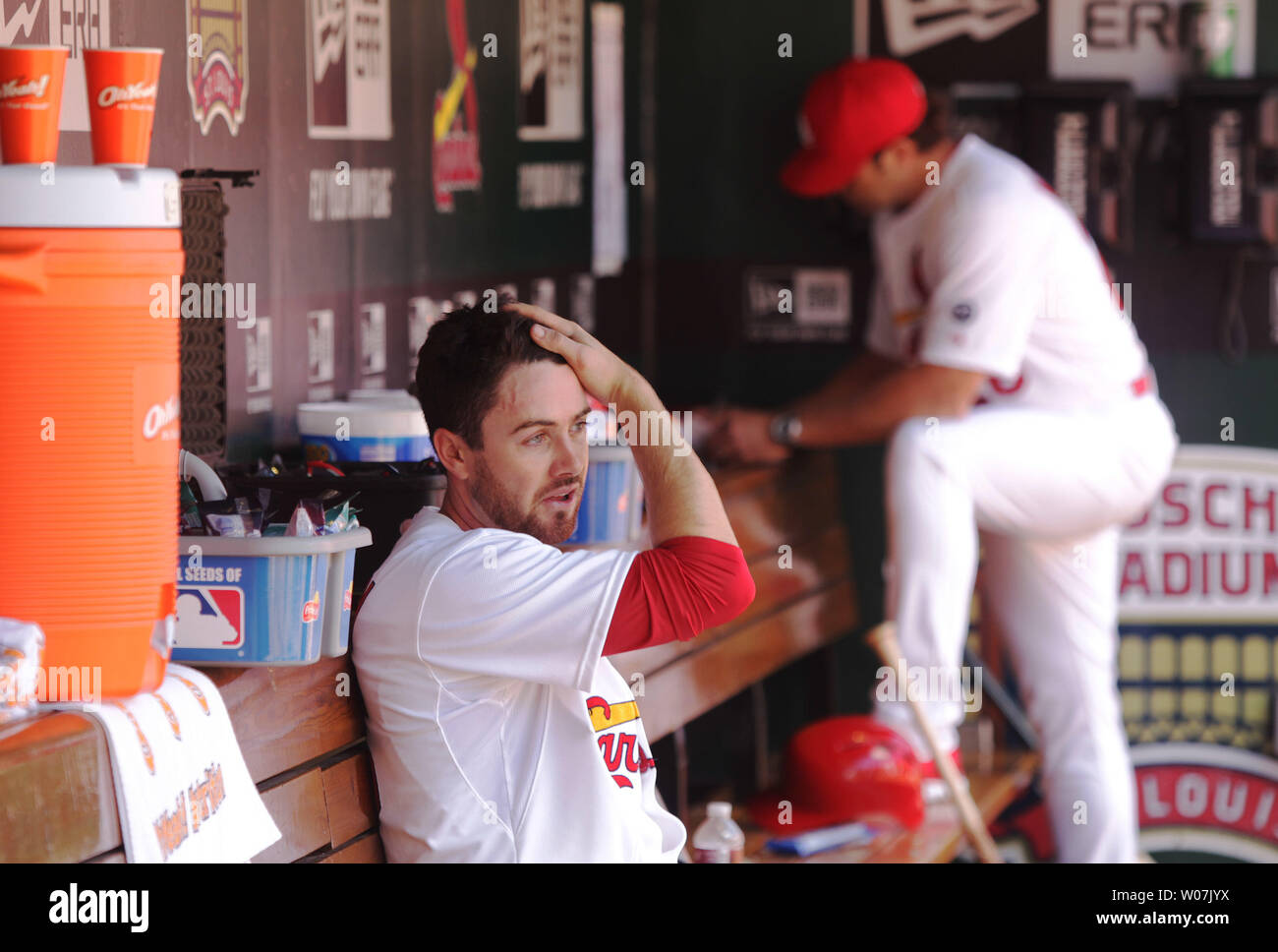 St. Louis Cardinals starting pitcher Tim Cooney sits in the dugout ...