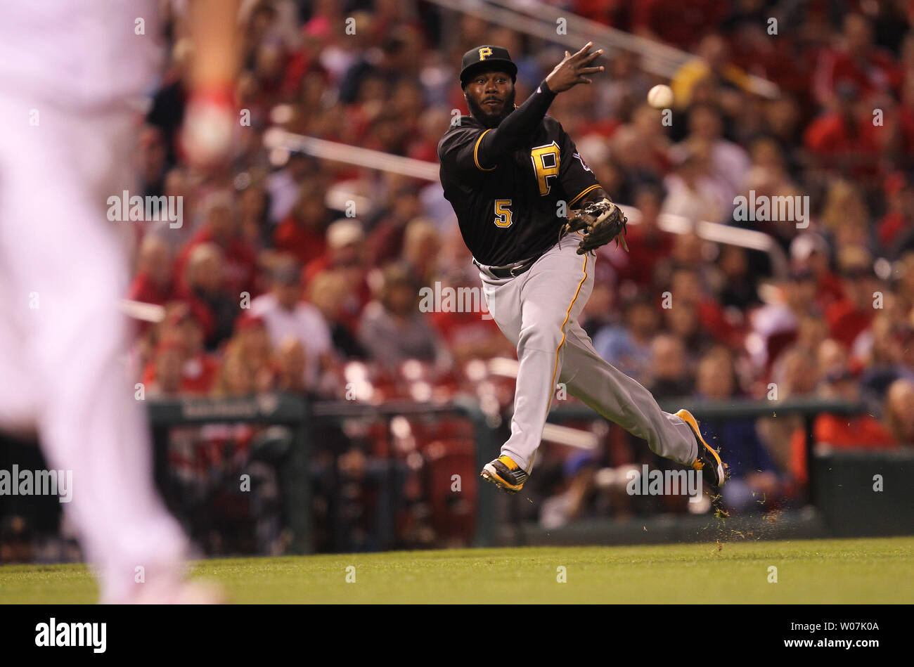 Pittsburgh Pirates Josh Harrison makes a throw off balance to get Matt ...