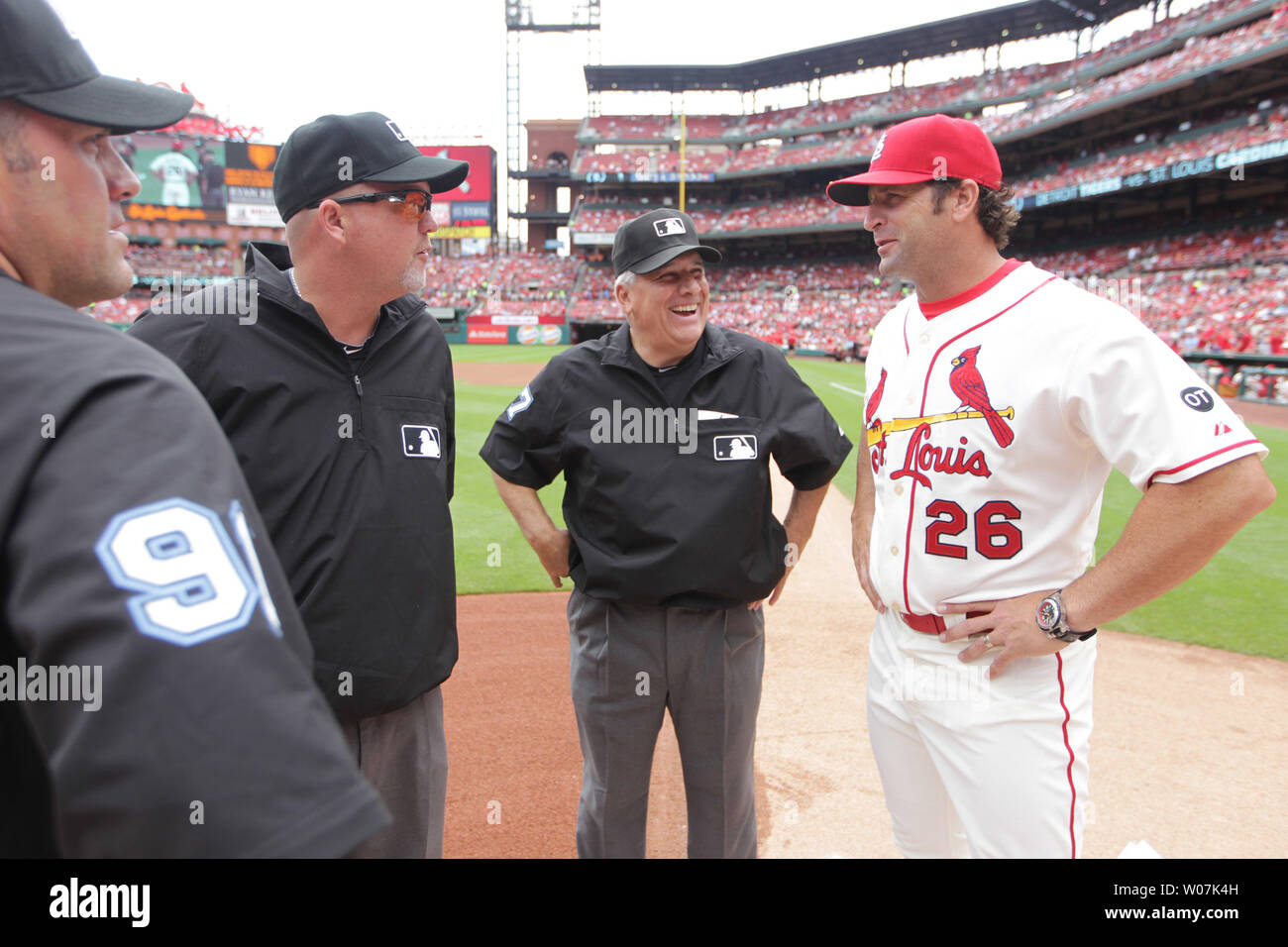 St. Louis Cardinals manager Mike Matheny jokes with umpires (L to R ...