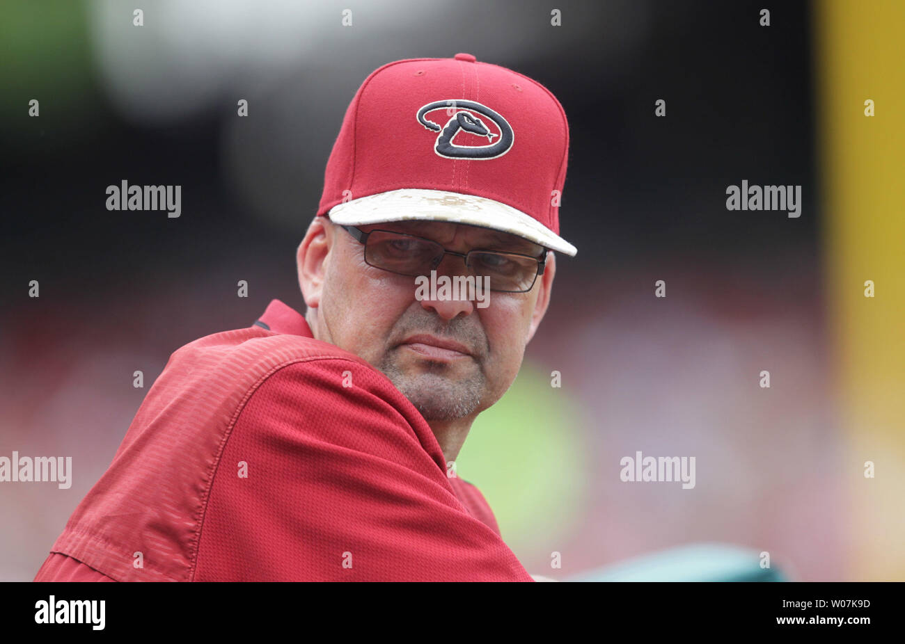 Arizona Diamondbacks coach Mark Grace looks around his dugout during ...