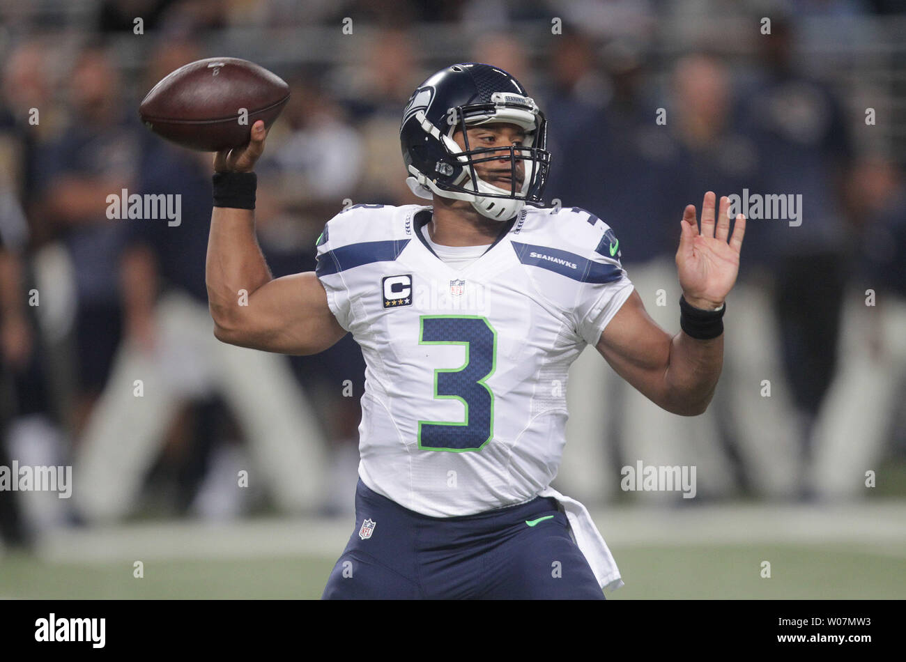 Seattle Seahawks Russell Wilson throws a pass in the second quarter against the St. Louis Rams ...