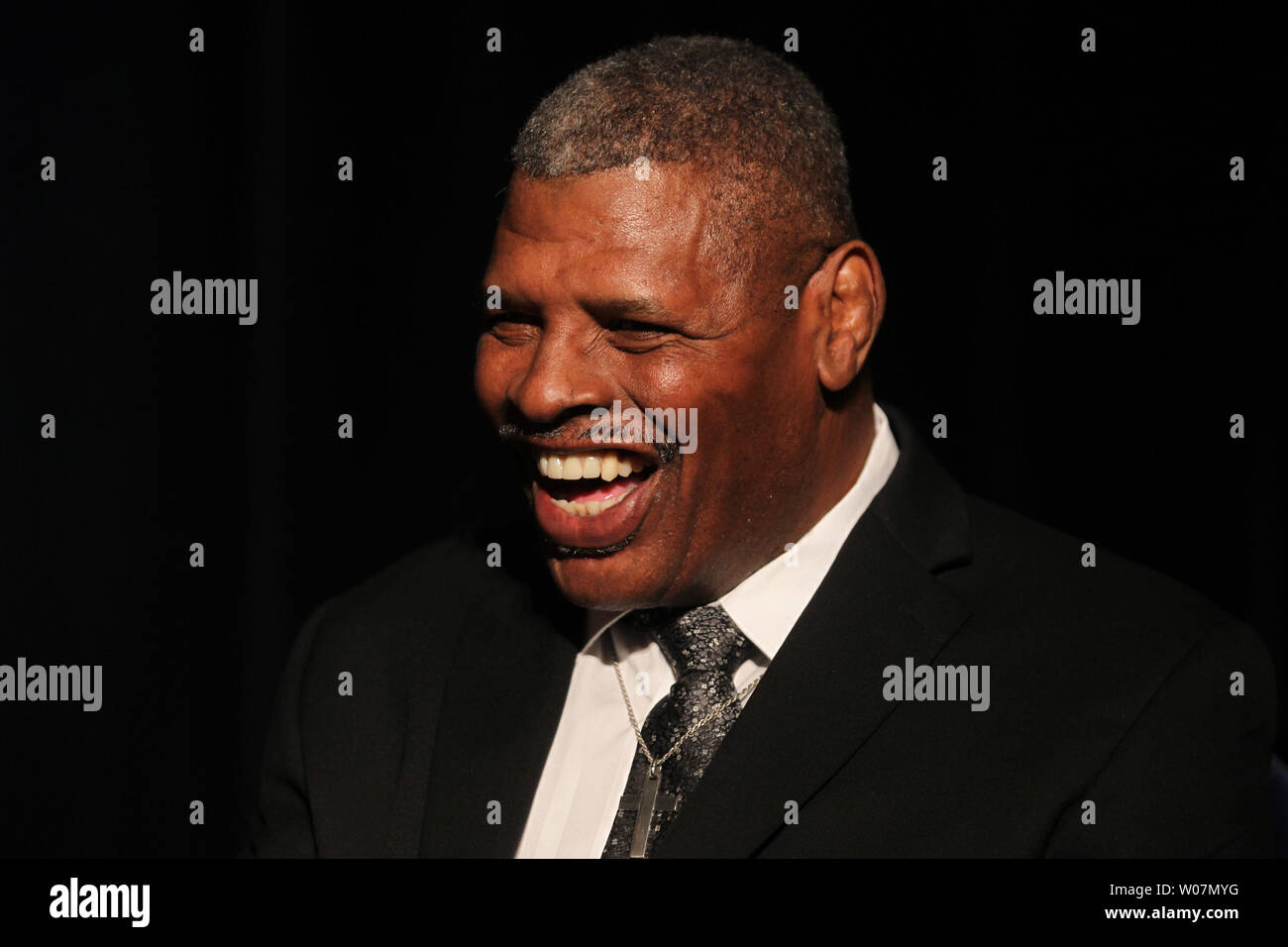 Leon Spinks, former heavyweight boxing champion smiles as he watches a ...
