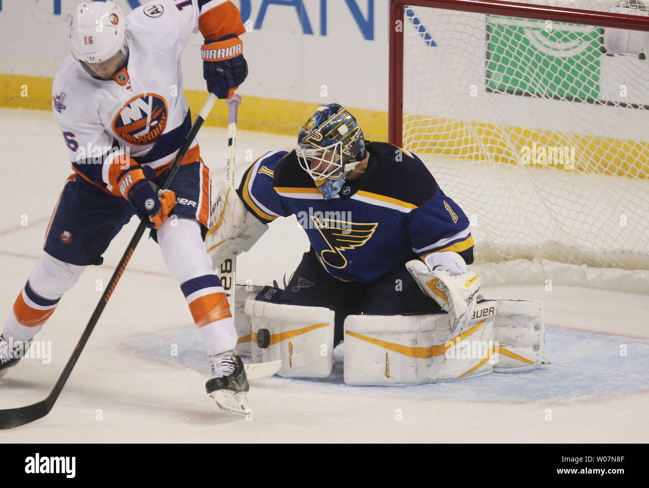 St. Louis Blues goaltender Brian Elliott makes a pad save as New York ...
