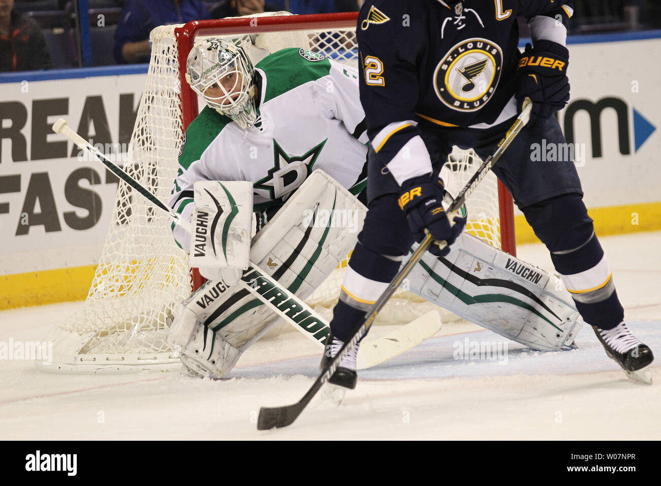 Dallas Stars Antti Niemi peeks around St. Louis Blues David Backes in ...