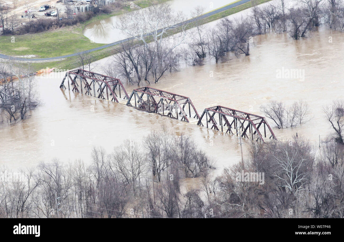 A railroad bridge is nearly covered by water from the Meramec River ...