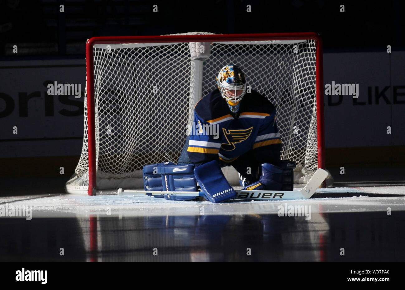 St. Louis Blues goaltender Brian Elliott stretches just before the ...