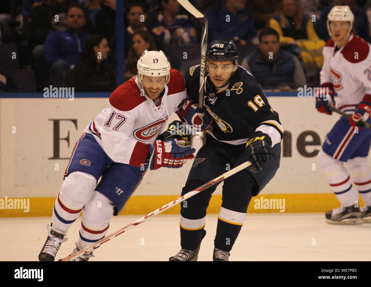 St. Louis Blues Ty Rattie pushes off of Montreal Canadiens Torrey ...