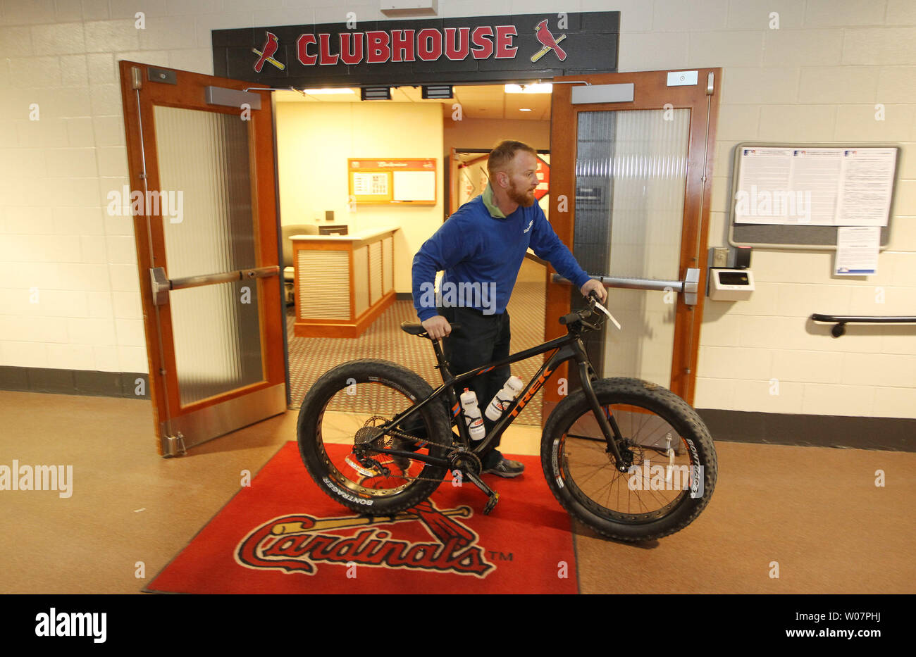 Mike Smith of A-Mrazek Moving Systems pushes a bicycle from the ...