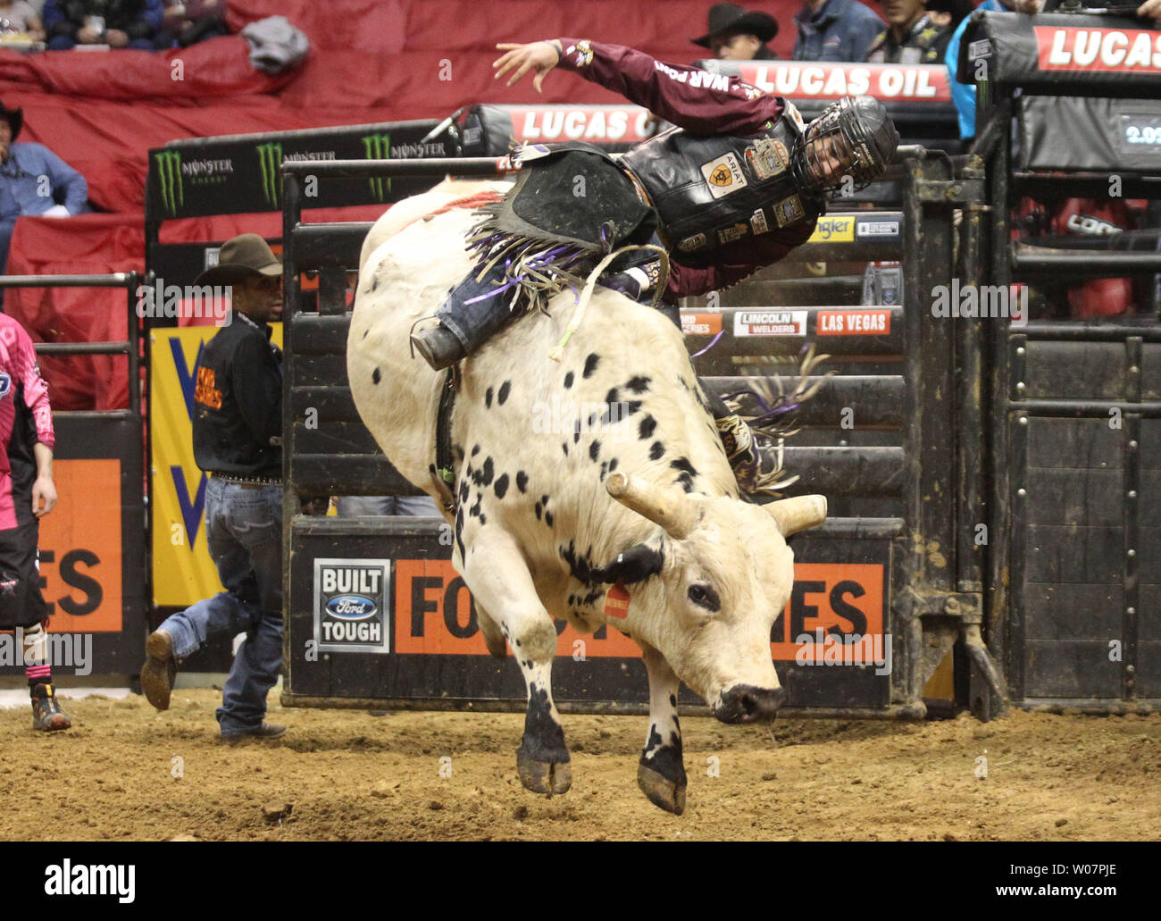 Bull rider Tyler Harr of Slovak, Arkansas holds onto Divinity the bull ...