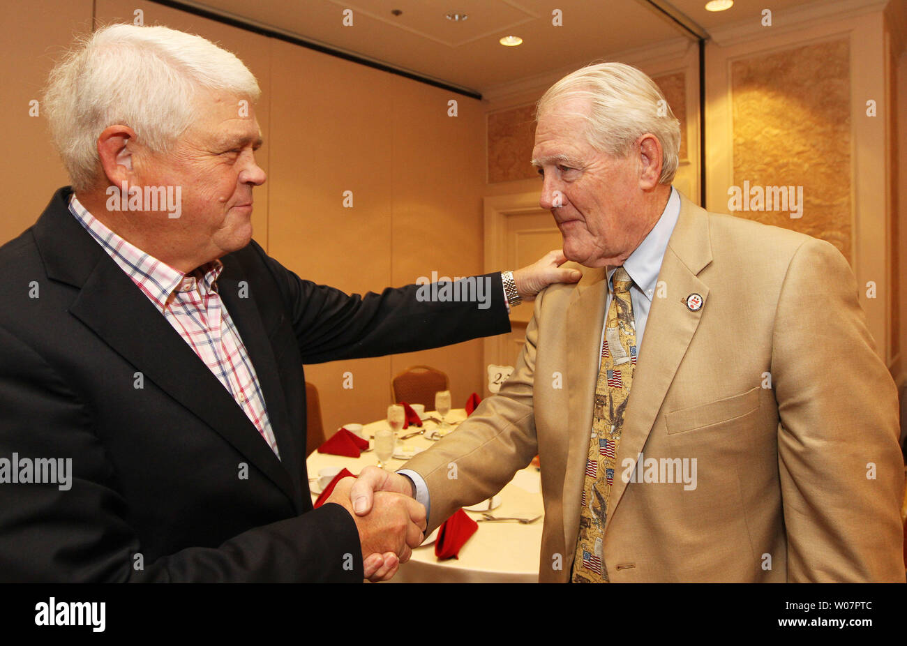 Former St. Louis Football Cardinal quarterback Jim Hart (L) greets ...