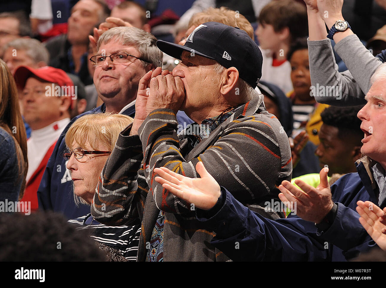 Actor Bill Murray cheers on Xavier from behind their bench as they play ...