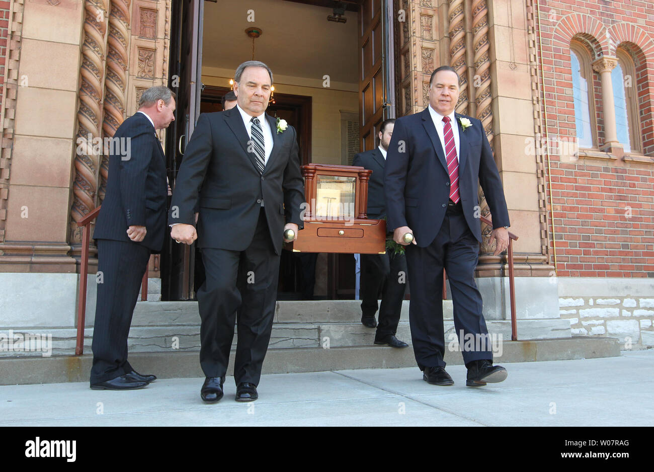 Sons Joe Garagiola Jr. (L) and Steve Garagiola, lead a procession with ...