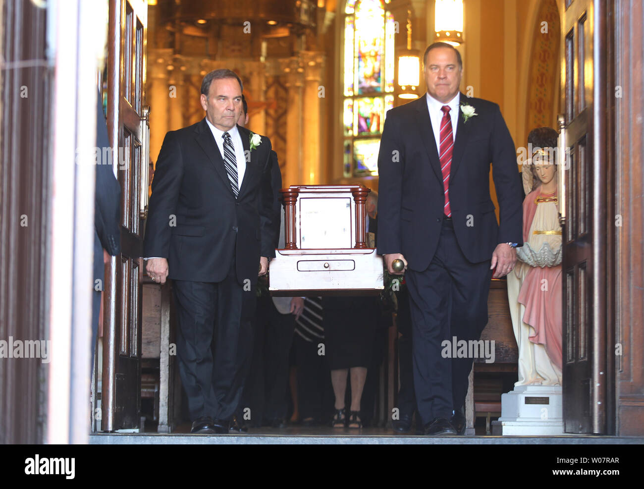 Sons Joe Garagiola Jr. (L) and Steve Garagiola, lead a procession with ...