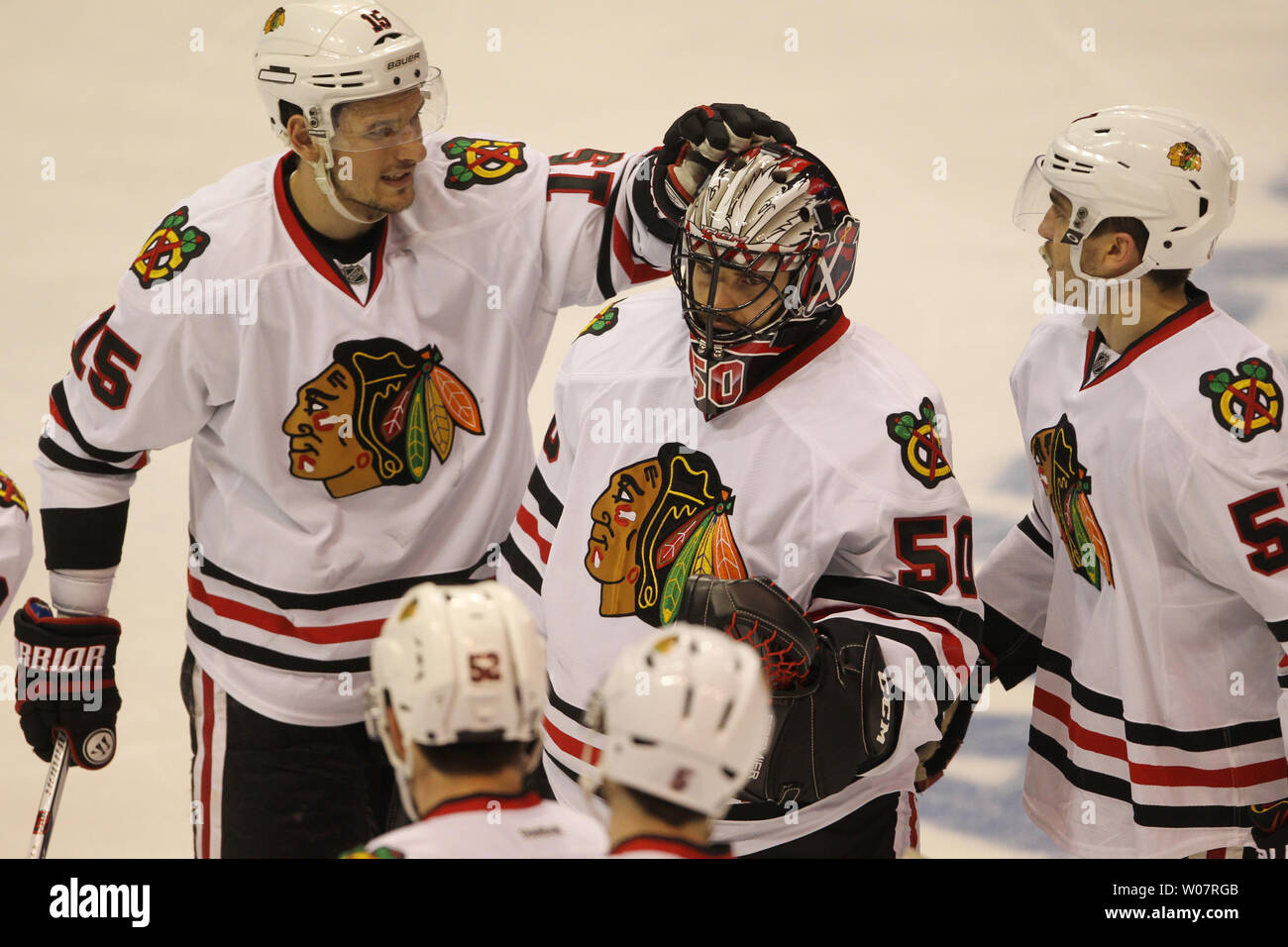 Chicago Blackhawks goaltender Corey Crawford is congratulated by ...