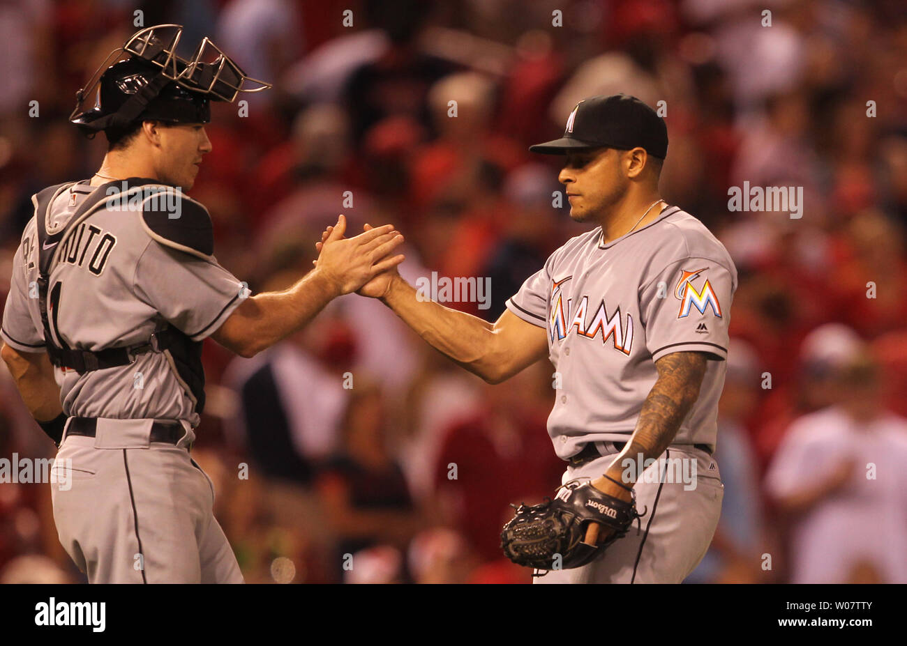 Miami Marlins A.J. Ramos and catcher J.T. Realmuto celebrate a a 7-6 ...