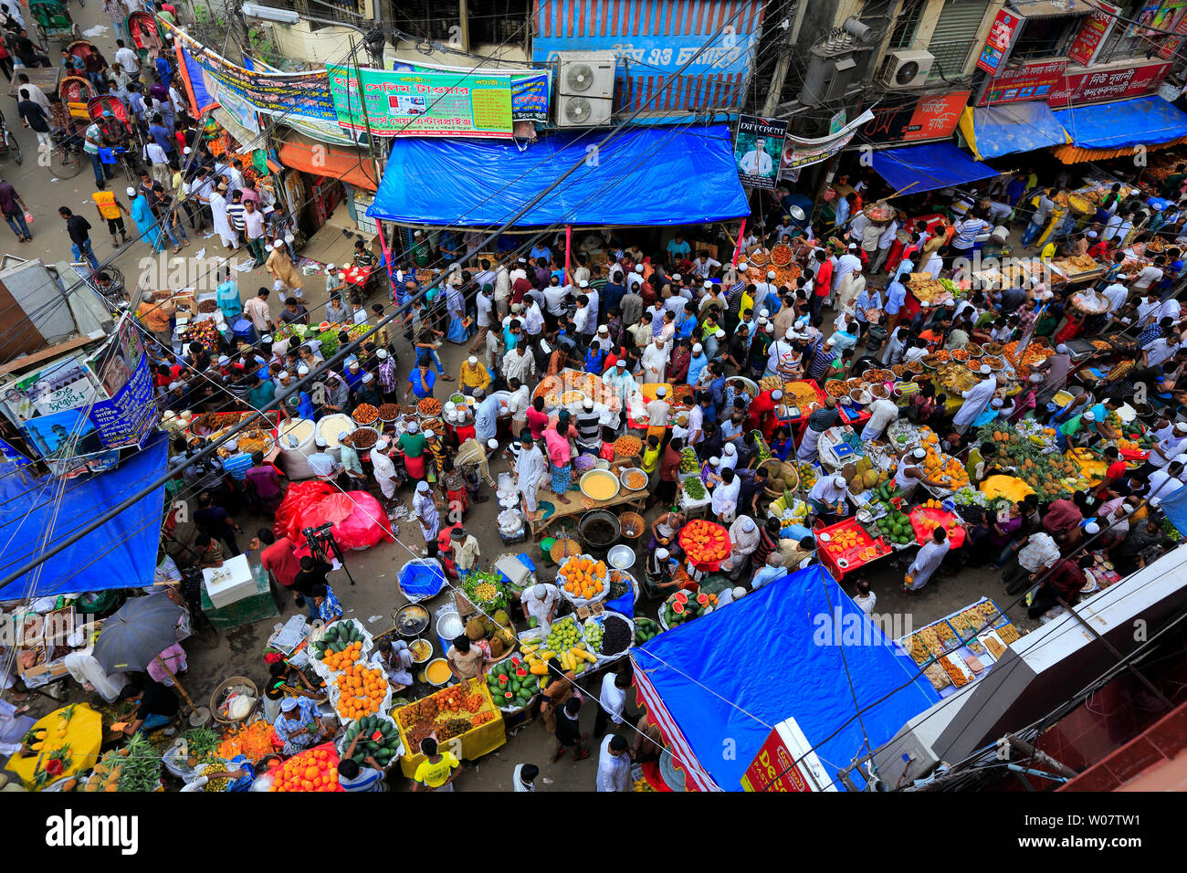 Chawk Bazar iftar market of Dhaka is well known for traditional spicy foods. Thousands of people ...