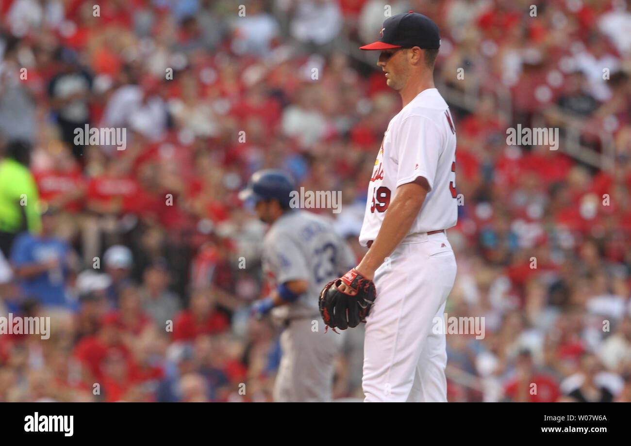 St. Louis Cardinals starting pitcher Mike Mayers can only watch as Los ...