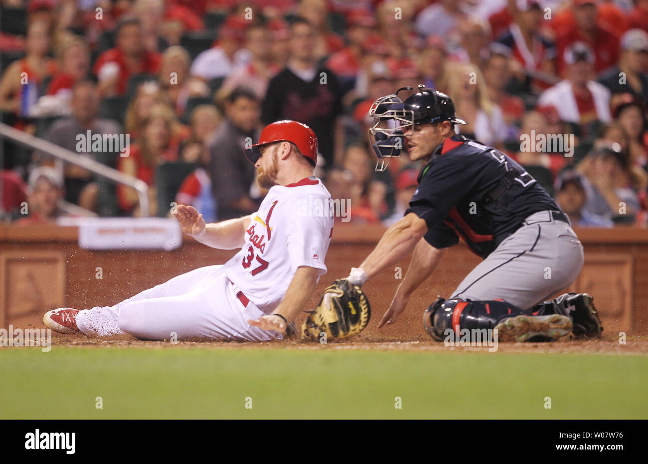 St. Louis Cardinals Brandon Moss is tagged out at home plate by Atlanta ...