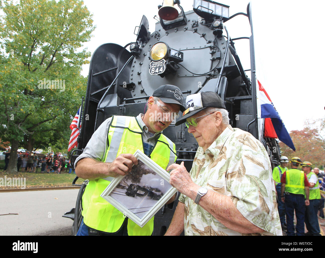 Engineer Ed Dickens (L) of Cheyenne, Wyoming presents former engineer ...