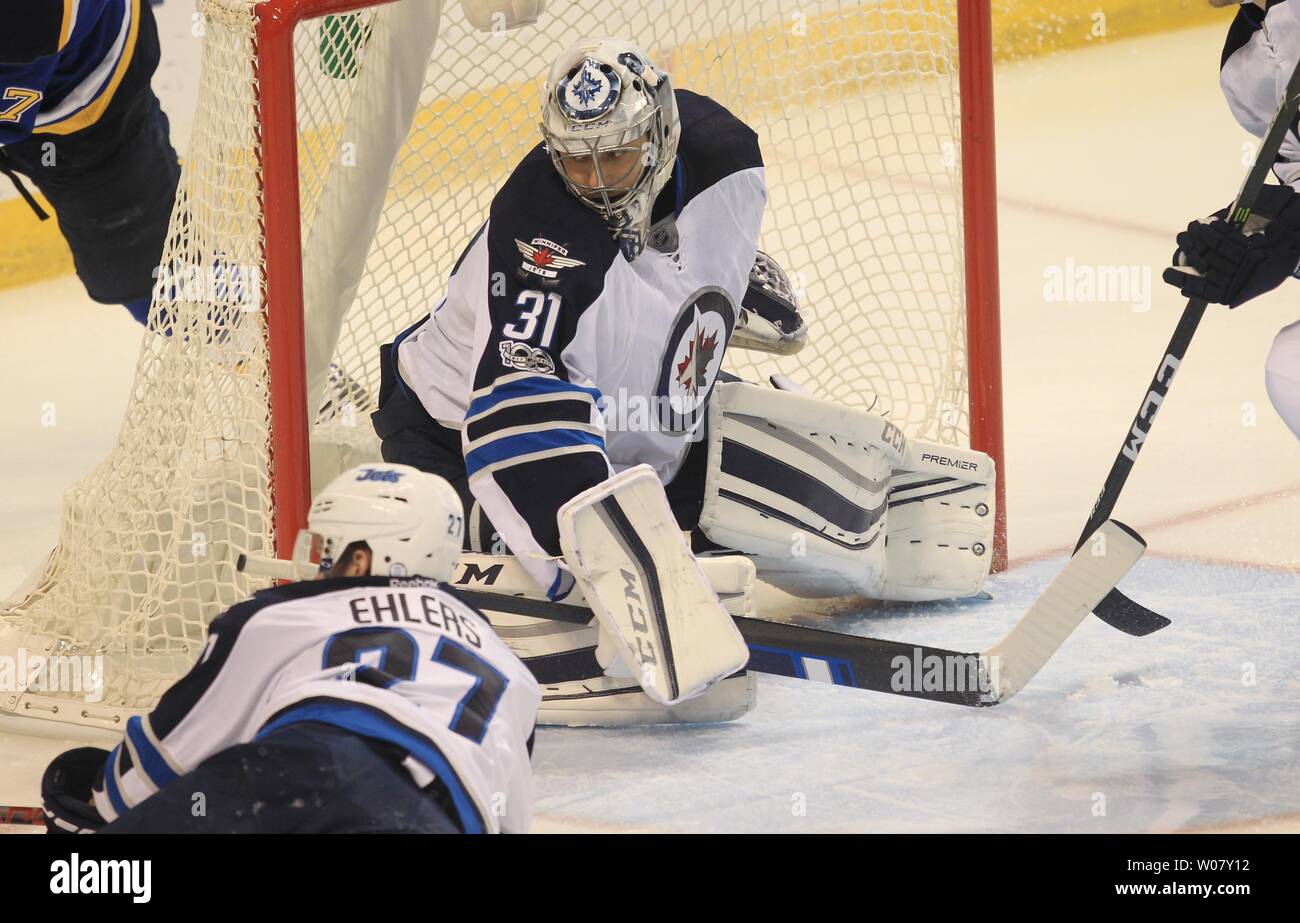 Winnipeg Jets goaltender Ondrej Pavelec gets help defending against the ...