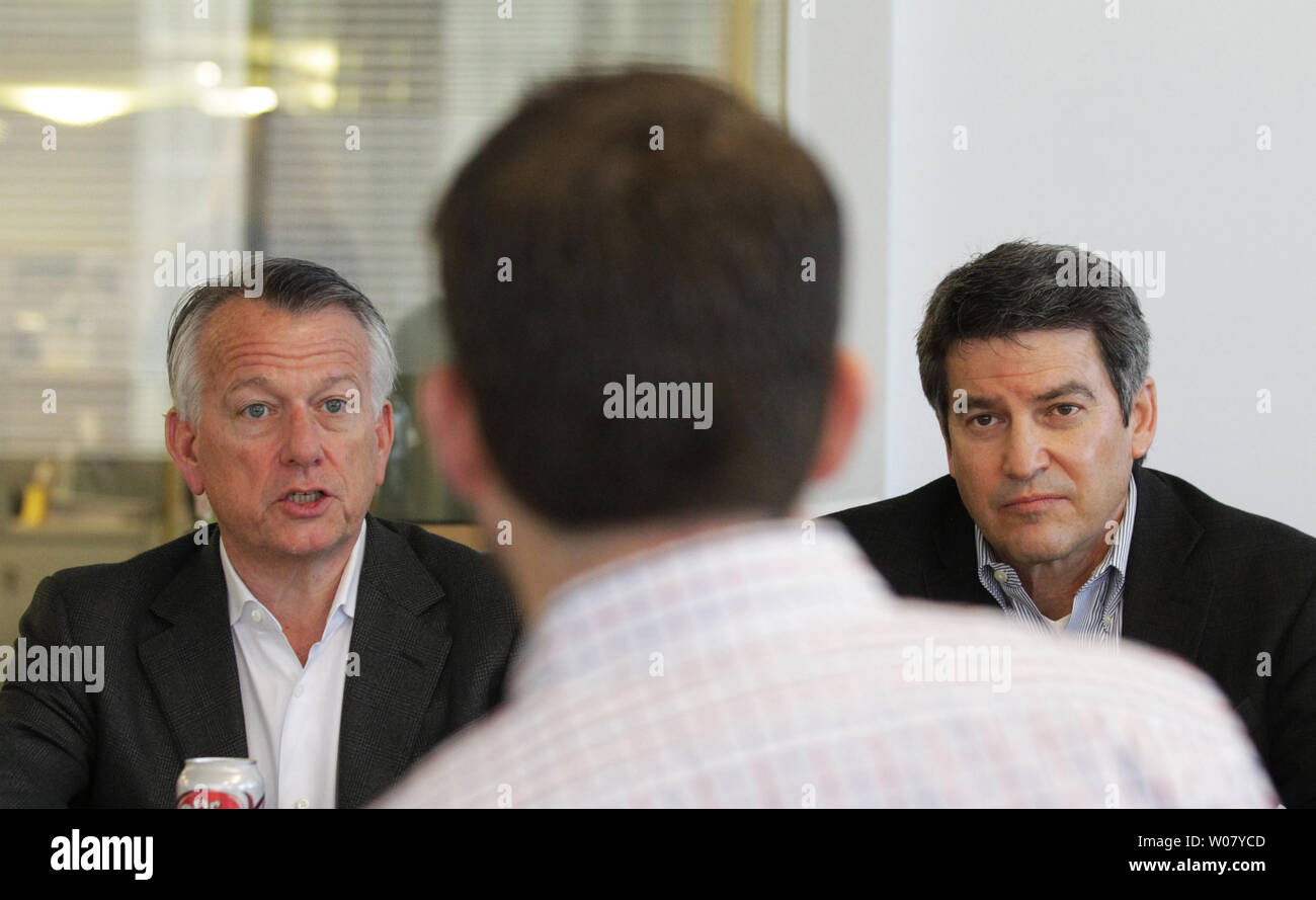 Paul Edgerley (L) and Terry Matlack talk soccer with a newspaper ...