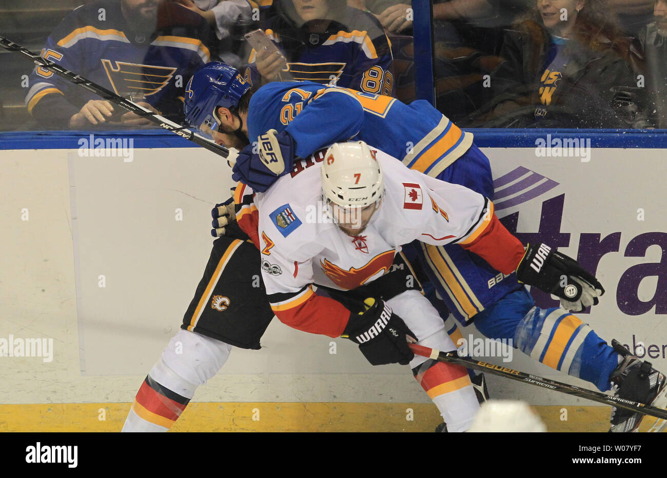 Calgary Flames TJ Brodie checks St. Louis Blues Alex Pietrangelo in the ...