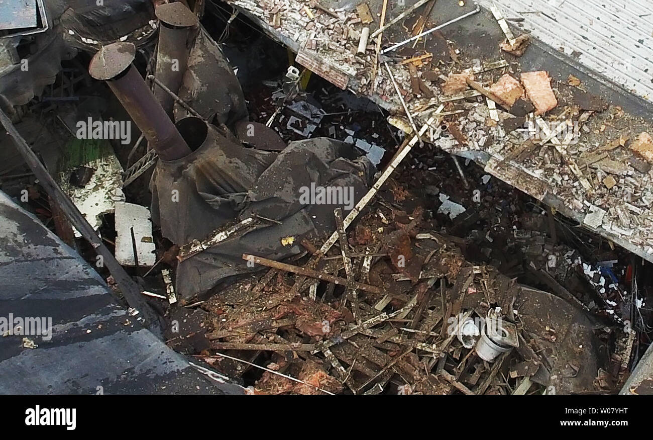 A photo of the roof of the Loy-Lange Box Company shows the damage of an ...