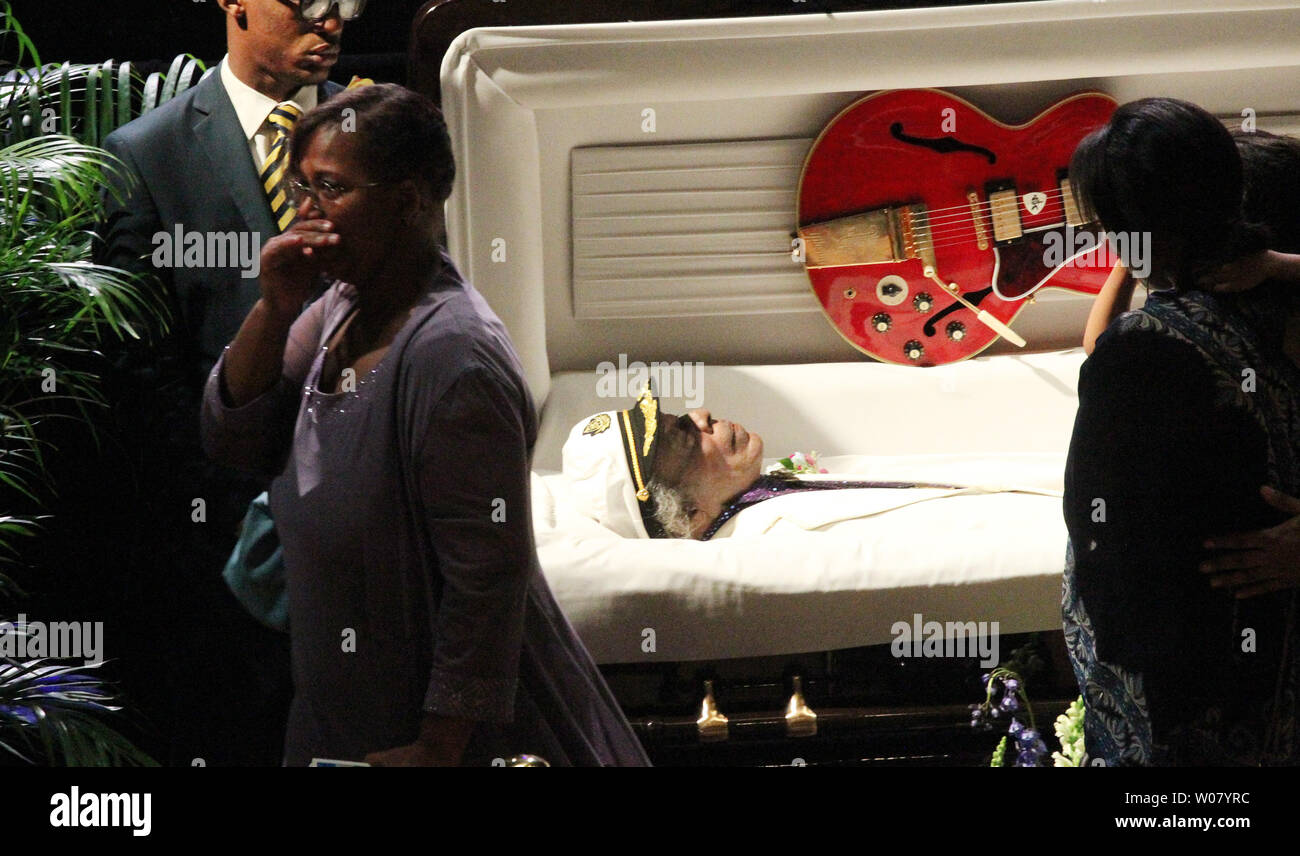 Family members file past the casket containing the body of the late ...