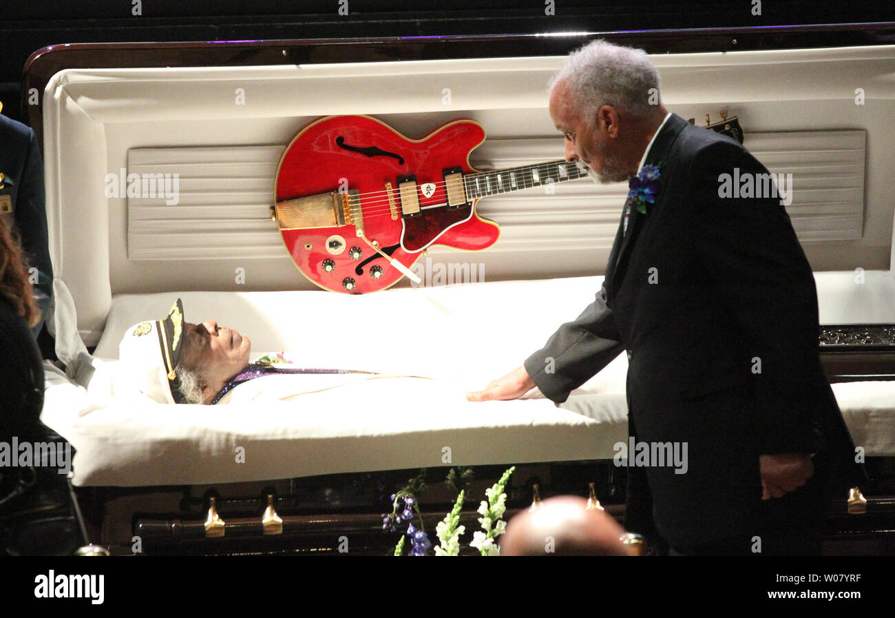 Family members of the late Chuck Berry file past his casket during a ...
