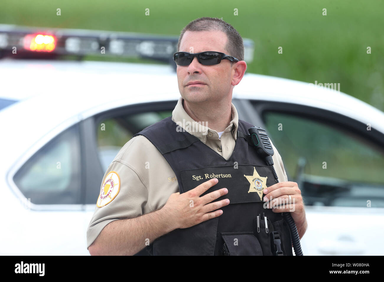 A St. Clair County Deputy Sherrif blocks a road to the home of James T ...