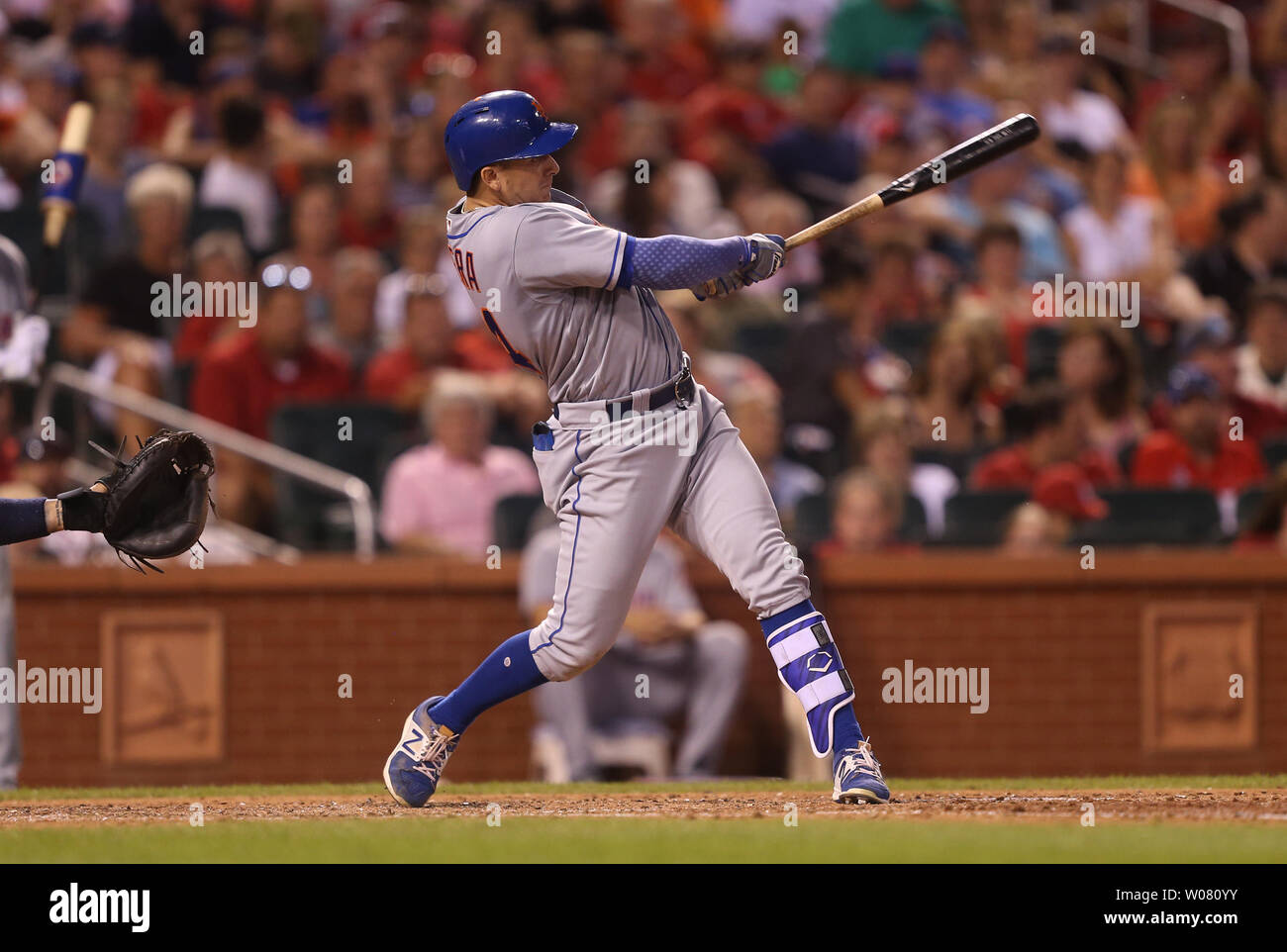 New York Mets T.J. Rivera swings, hitting a RBI double in the seventh ...