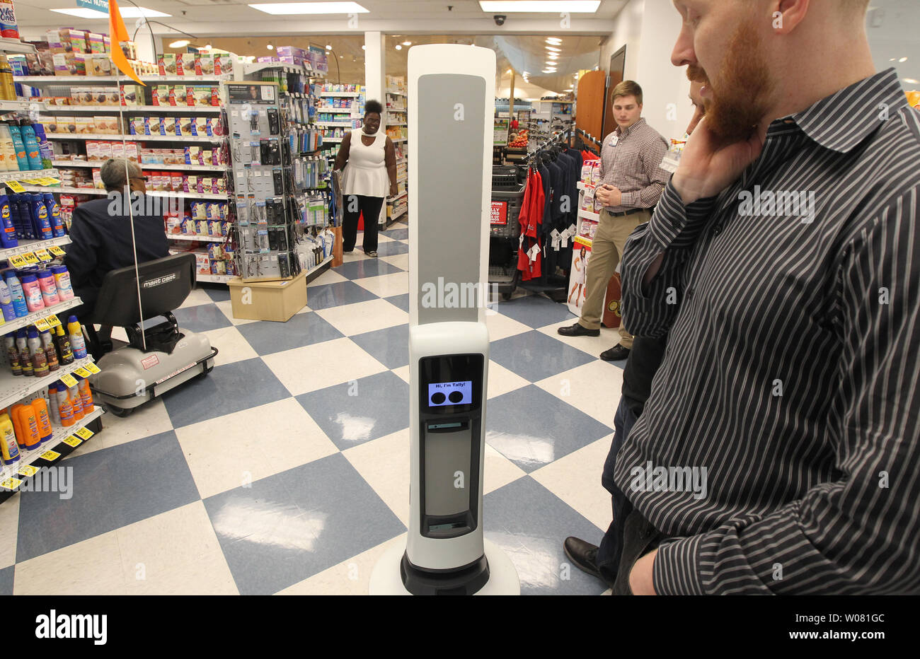 Tally the robot mingles with customers and handlers before checking ...